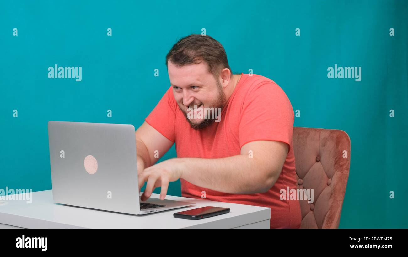 Funny frames of male using laptop. man working on a computer pretending ...