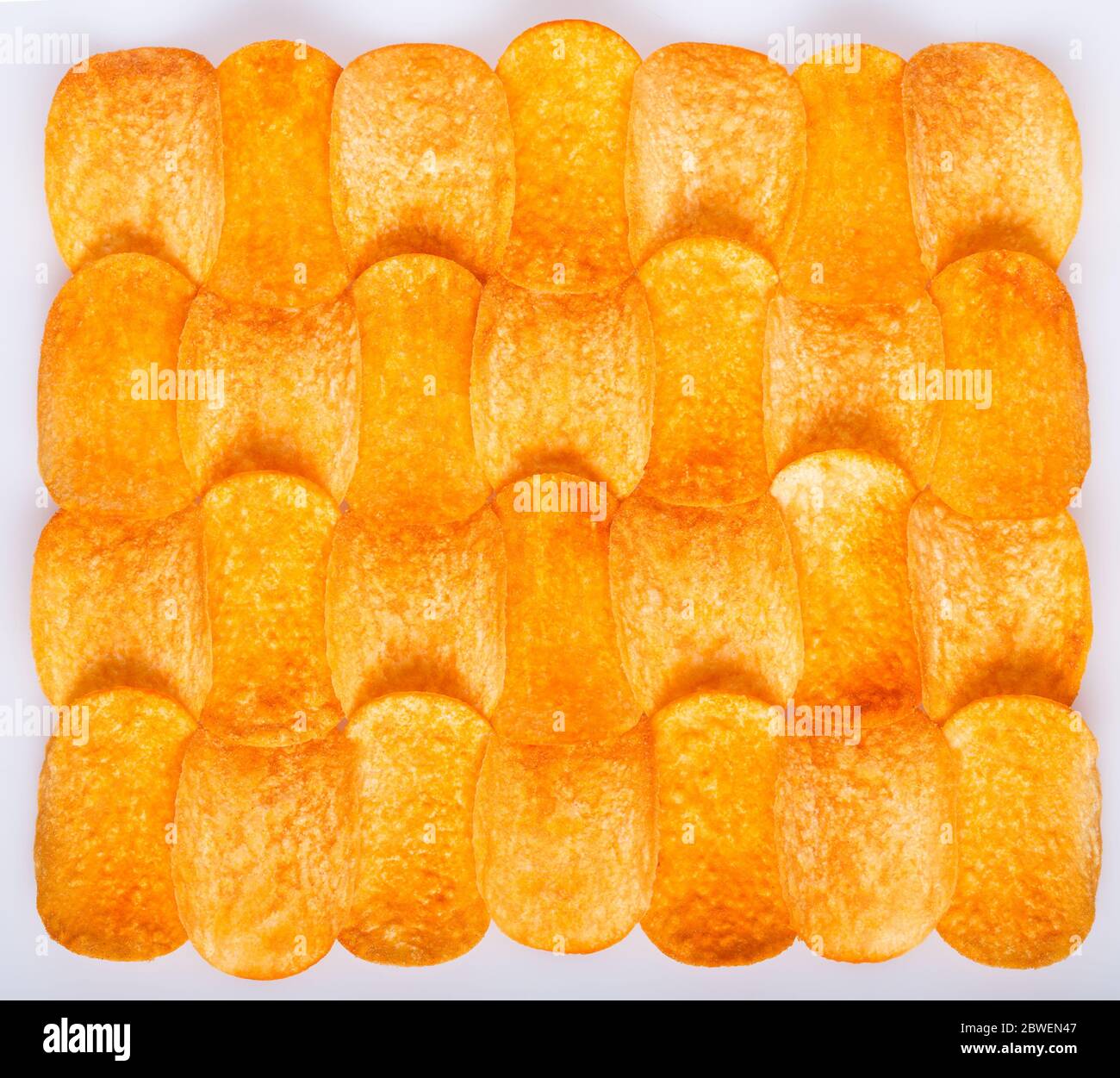 appetizing potato chips background folded like scales Stock Photo - Alamy
