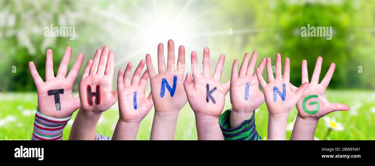 Children Hands Building Word Thinking, Grass Meadow Stock Photo - Alamy