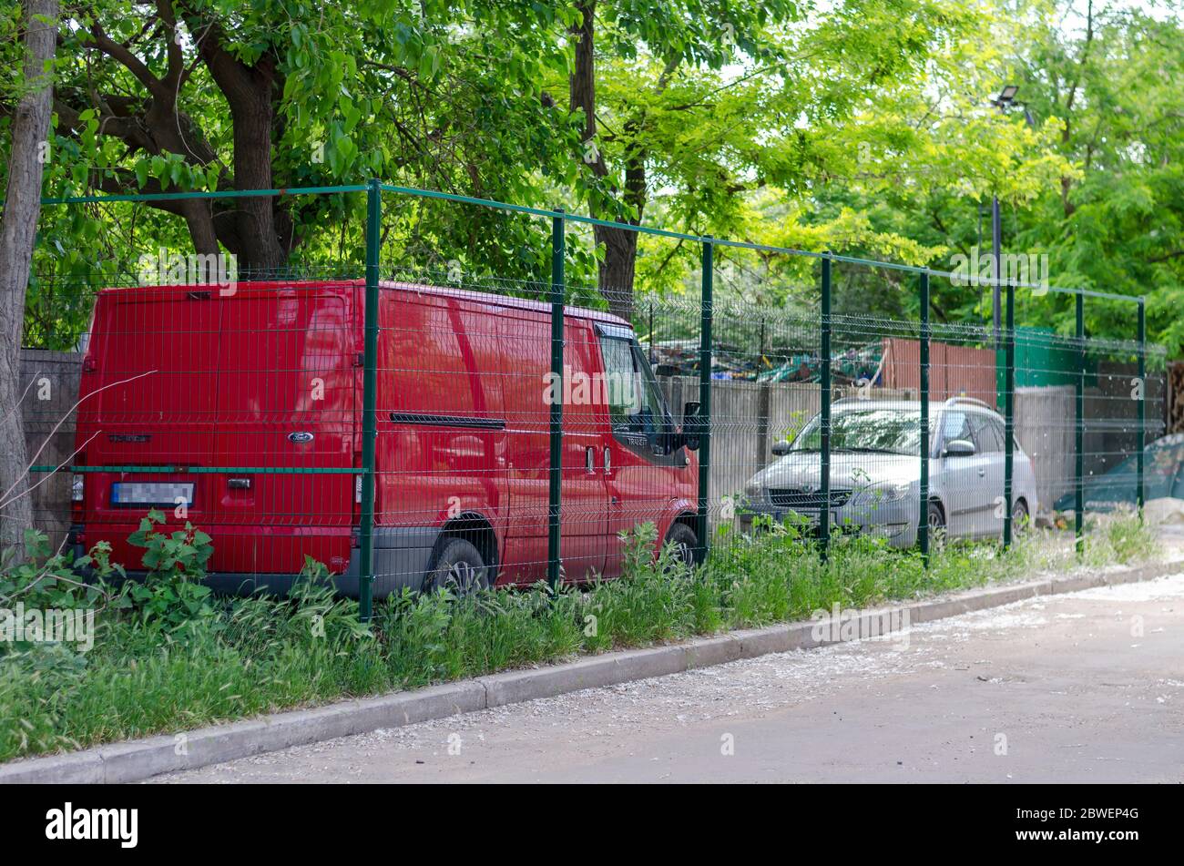 Car parked parking fence fenced hi-res stock photography and images - Alamy