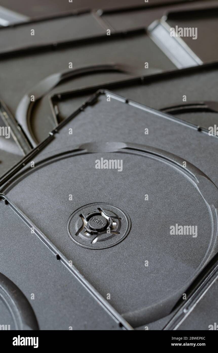 Empty black box dvd background. A pile of open plastic boxes for cd ...