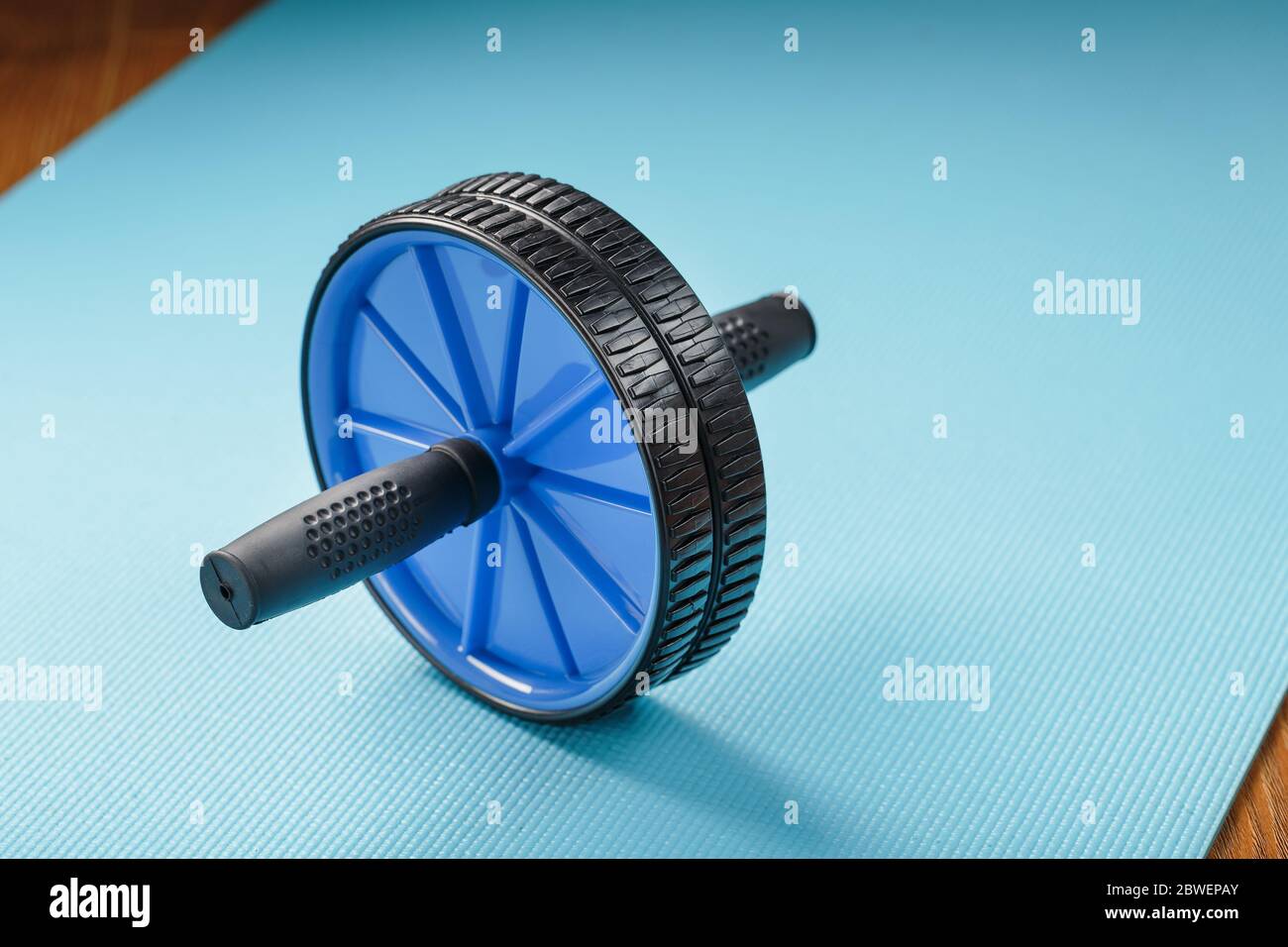 Sports roll for training muscles and abs on the blue Mat Stock Photo ...