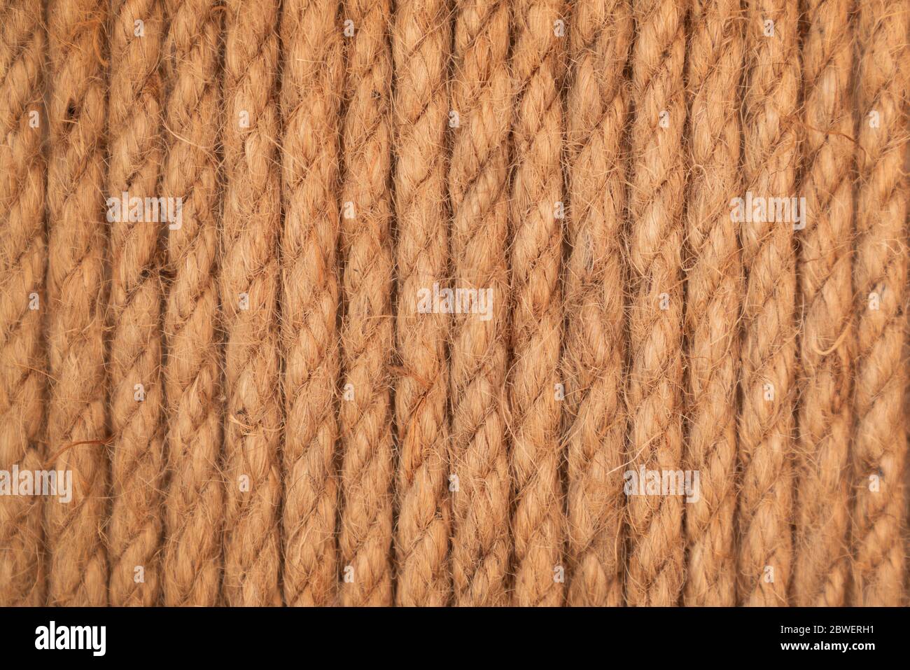 Brown twisted rope in aline. Brown and yellow rope textured background ...