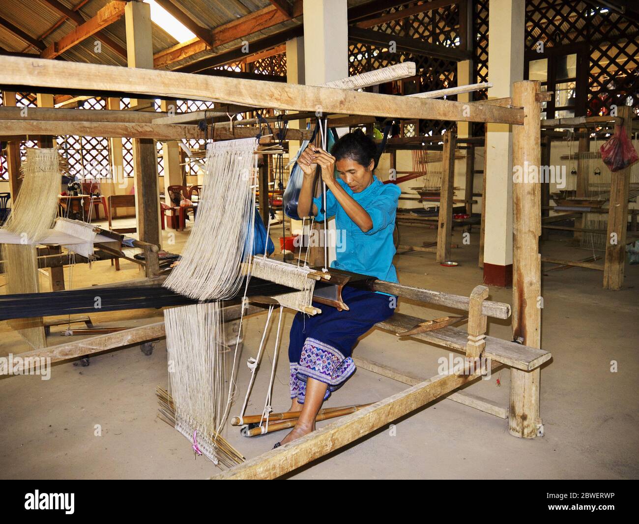 The weaving Factory in Laos Stock Photo - Alamy