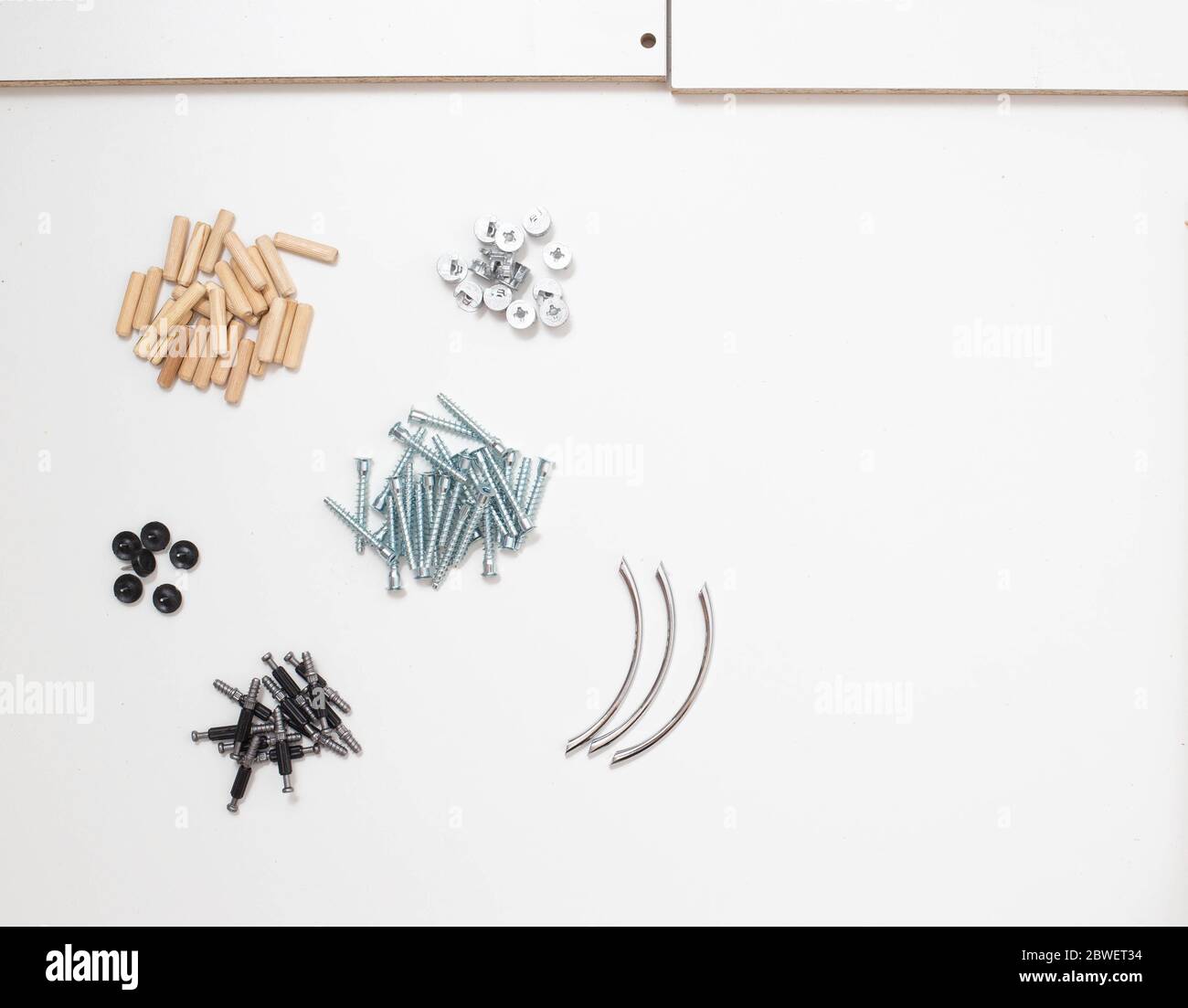 furniture assembly parts tie screws and wooden dowels, copy space ...