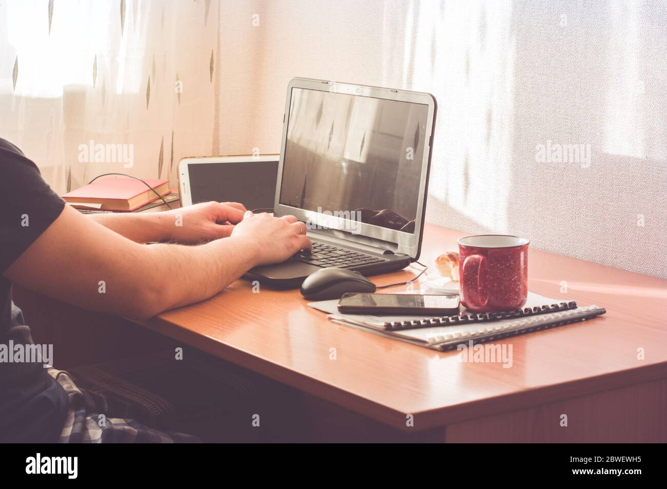 Man working from home. Distance work or online education or stay home ...