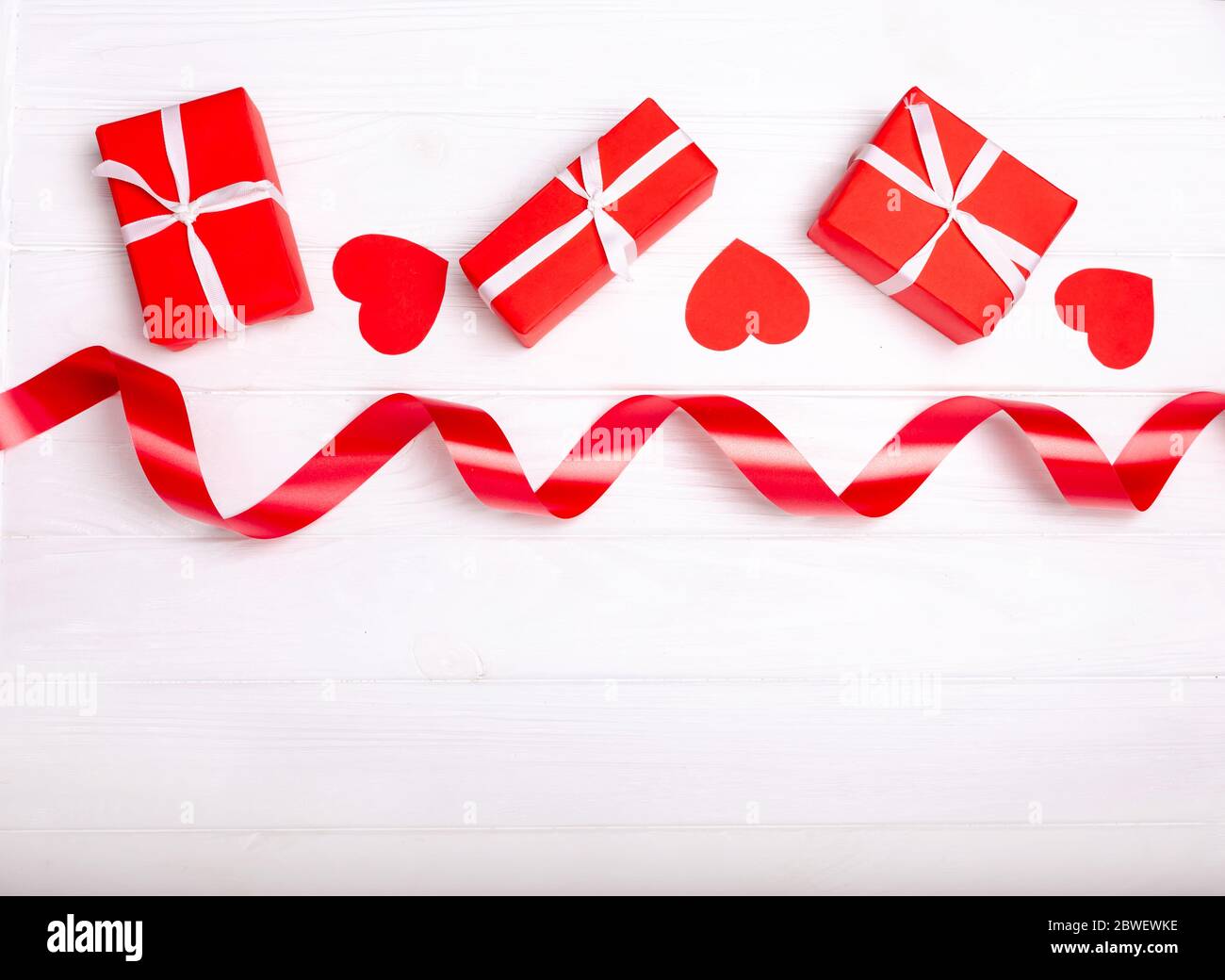 Red ribbon and box isolated on white background Stock Photo - Alamy