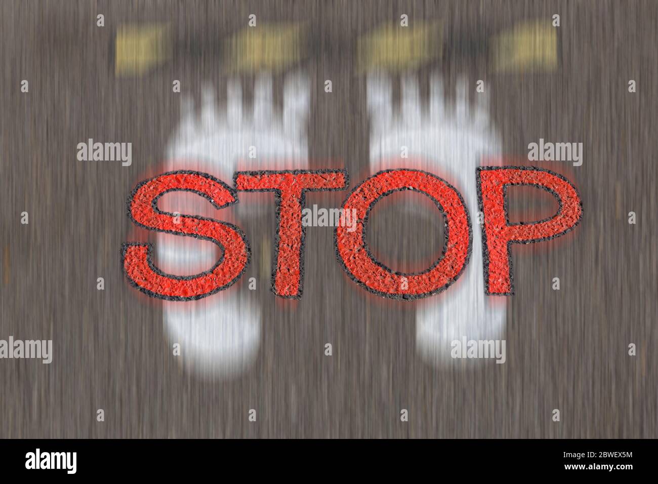 Stop sign with blurred footprints on pavement at Poole, Dorset UK in ...