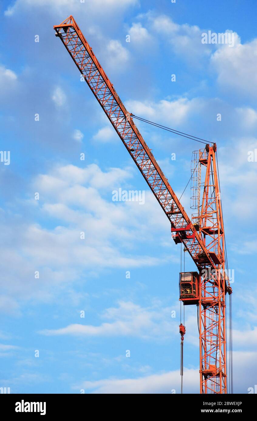 Industrial theme. Yellow construction crane against blue sky Stock ...