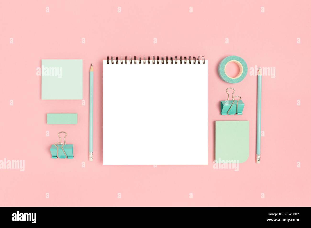 Notepad template with mint stationery on a pink pastel background ...