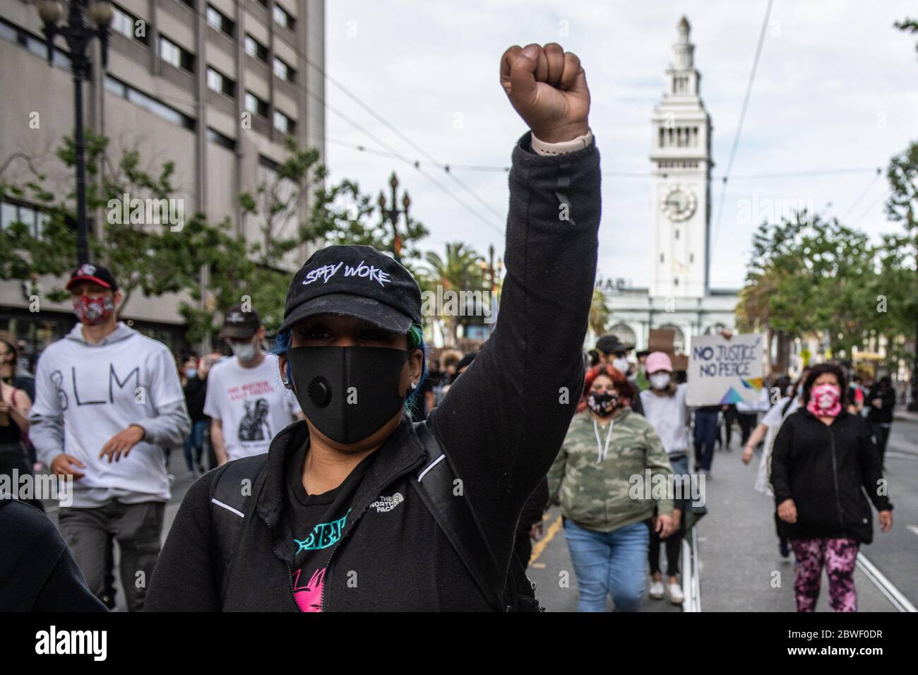 San Francisco, Ca. 31st May, 2020. Protestors march down Market Street ...