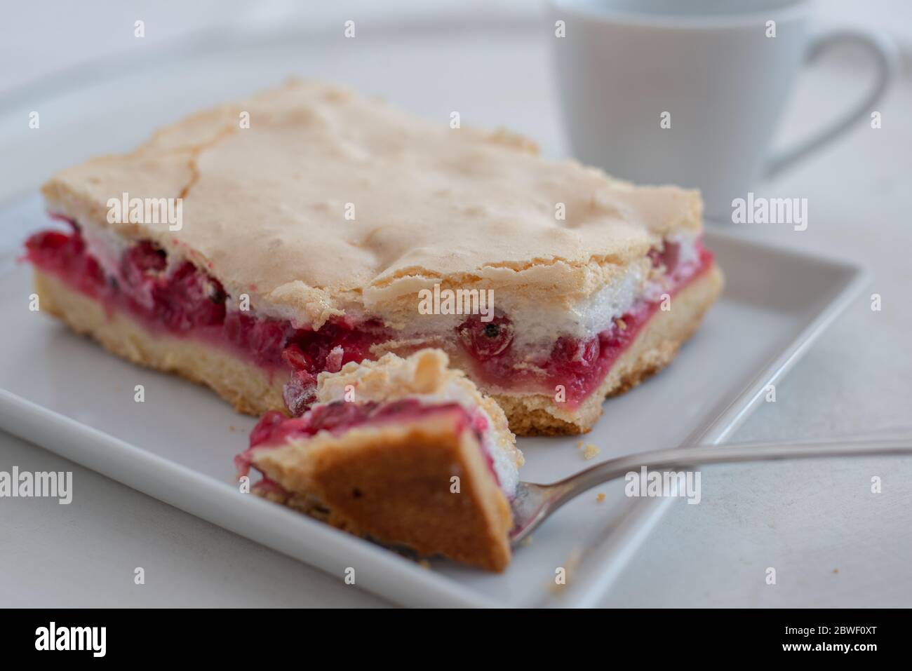 Delicious home made tart with red currants and meringue Stock Photo - Alamy