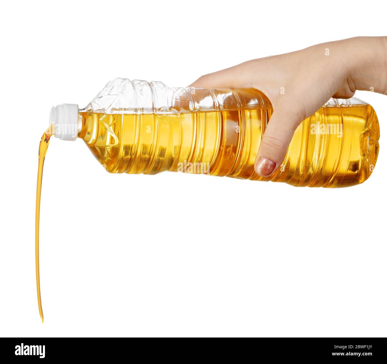 Hand of woman pouring cooking oil from plastic bottle. Isolated on ...