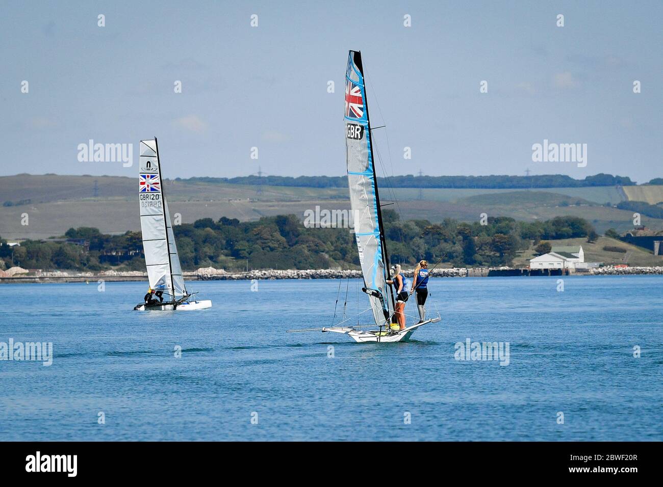 Team gb athletes sail out harbour during hi-res stock photography and ...