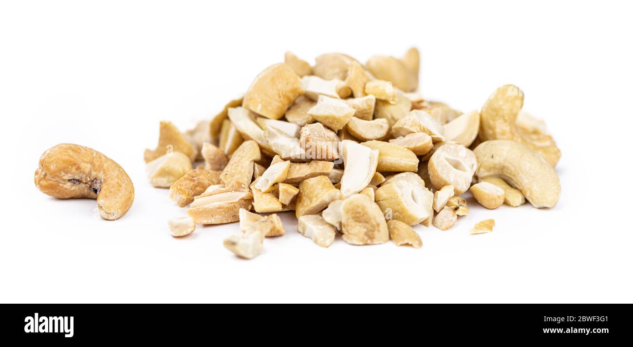 Chopped Cashew nuts isolated on white background as detailed close-up ...