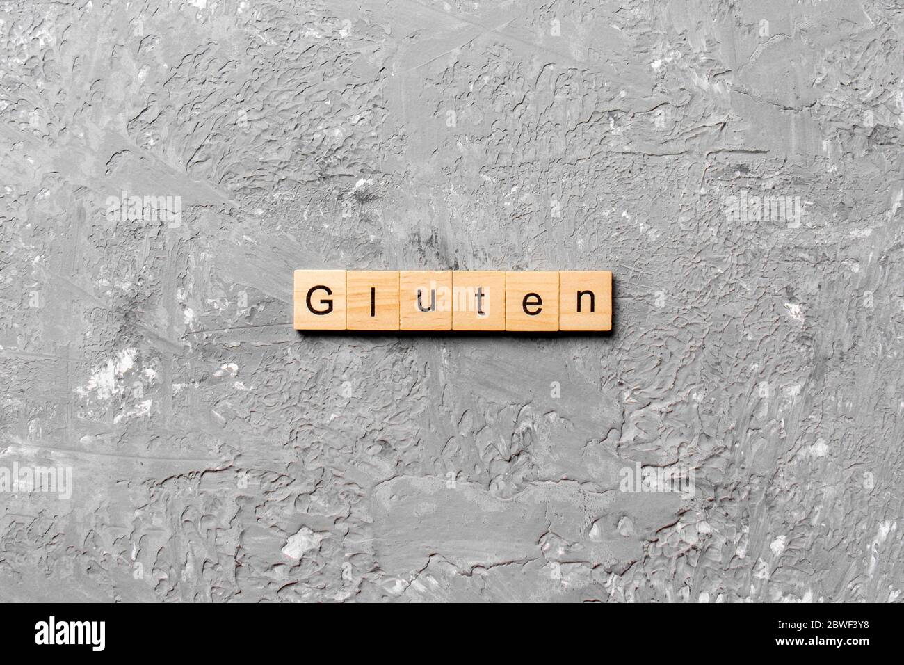 gluten word written on wood block. gluten text on table, concept Stock ...