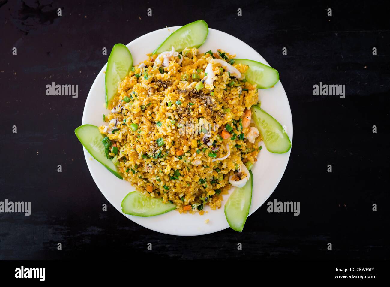 Stir fried rice with seafood: prawns, squid, octopus, carrot, egg ...