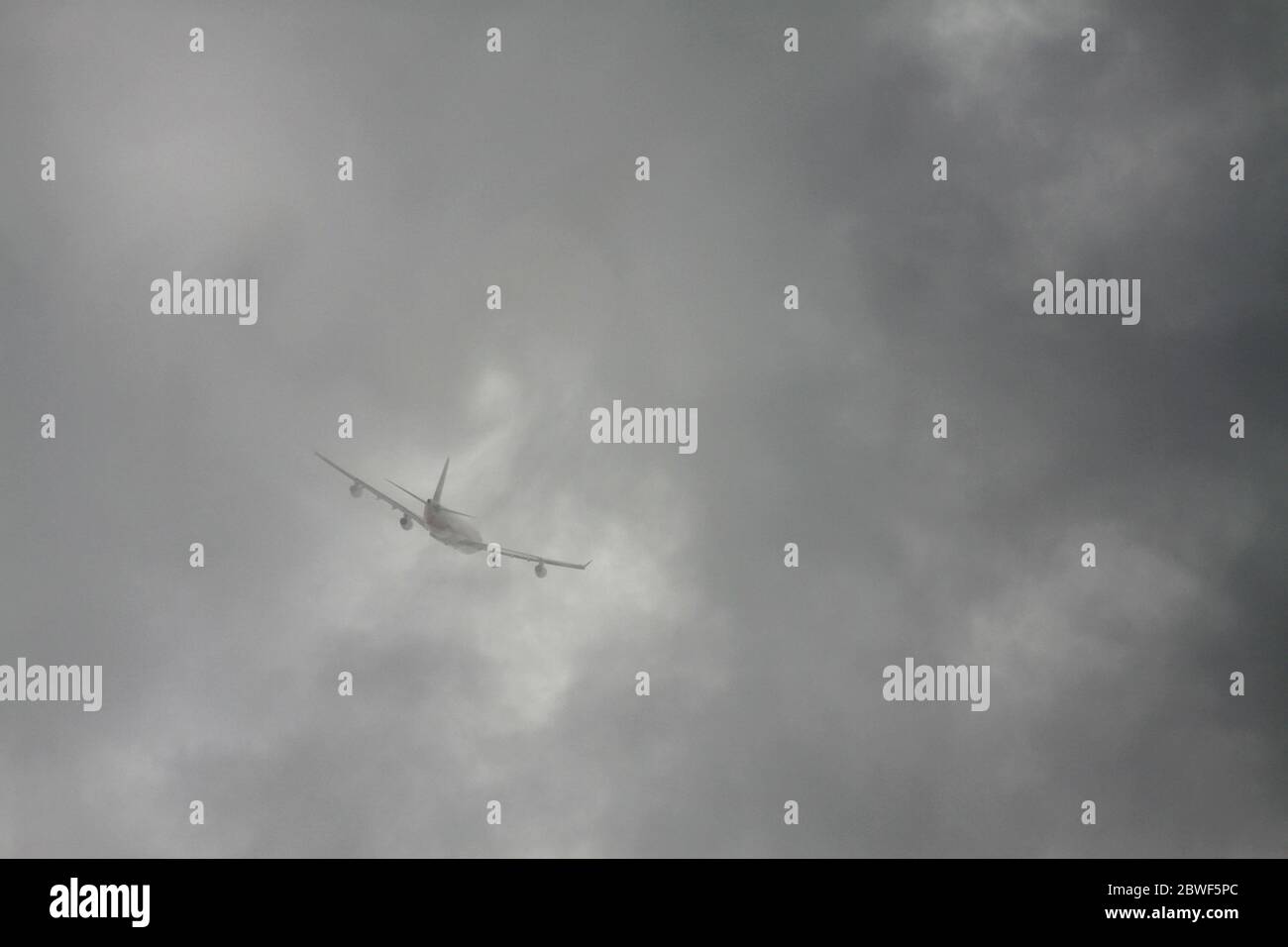 aircraft flying into bad weather after departure Stock Photo - Alamy