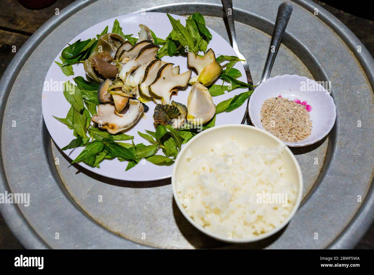 Delicious fresh prepared snail on the Ong Lang beach. Traditional ...