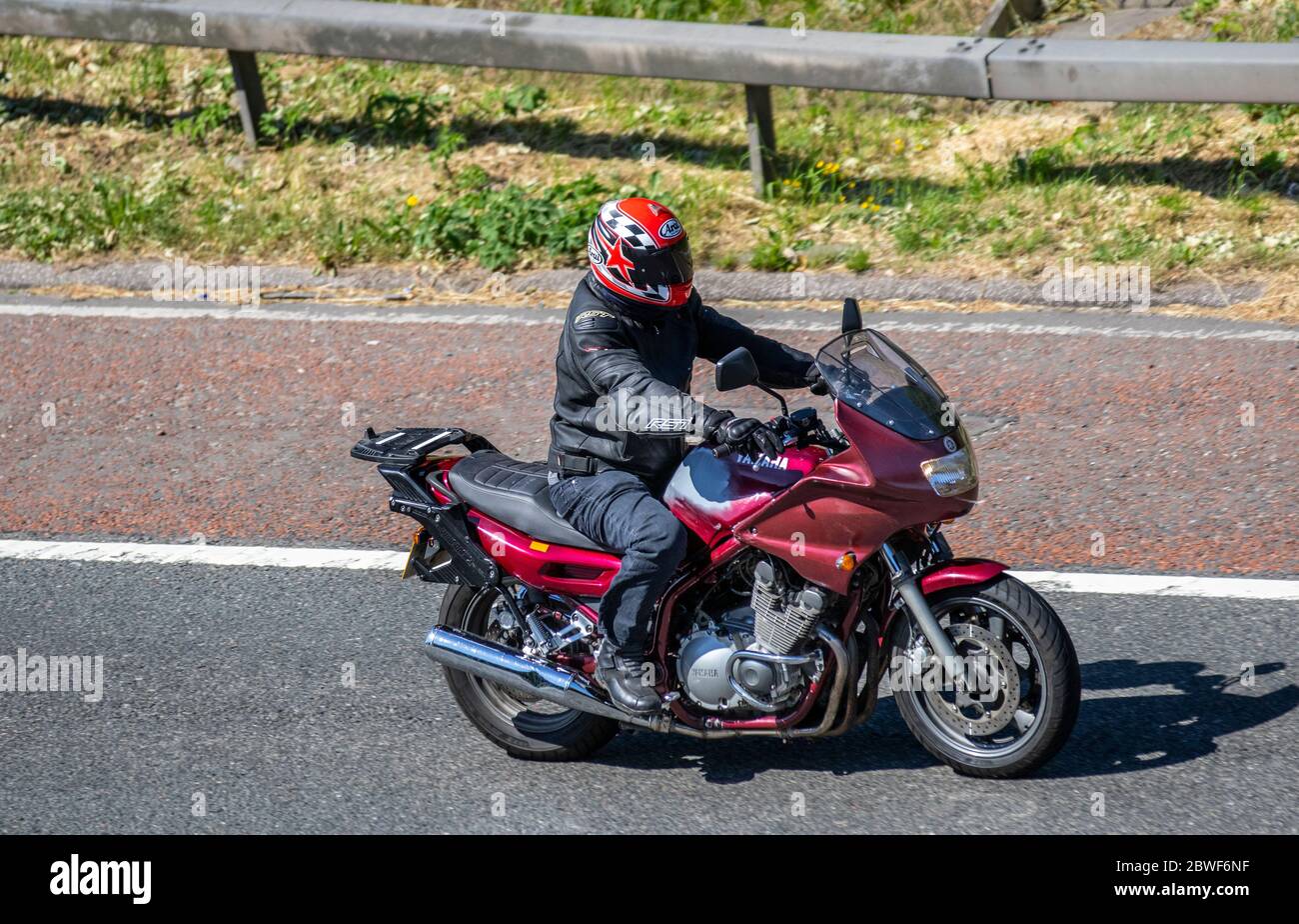 Red Yamaha Motorbike rider; two wheeled transport, motorcycles, vehicle ...