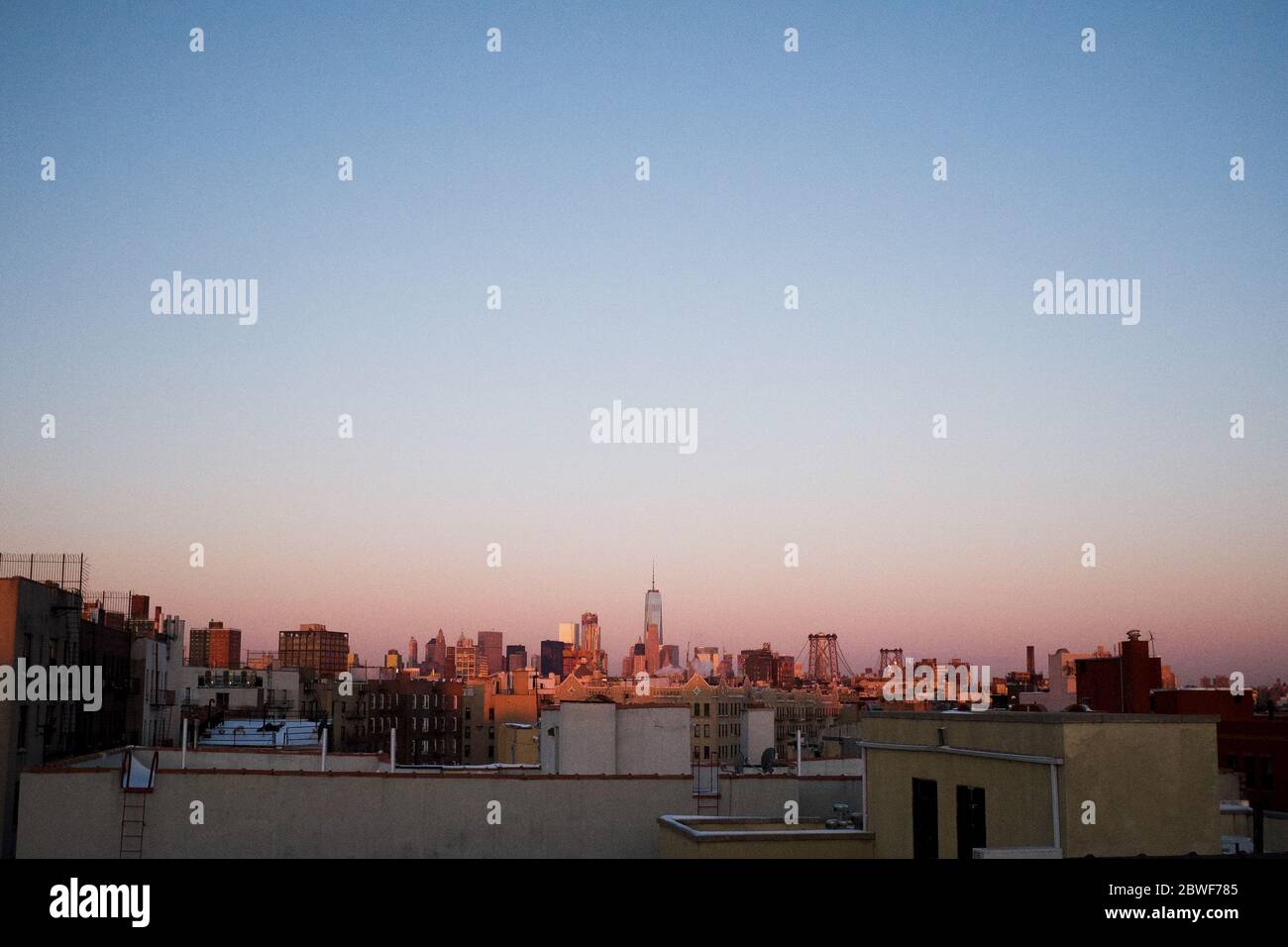 Rising sun over Manhattan, New York City, seen from a roof in Brooklyn ...