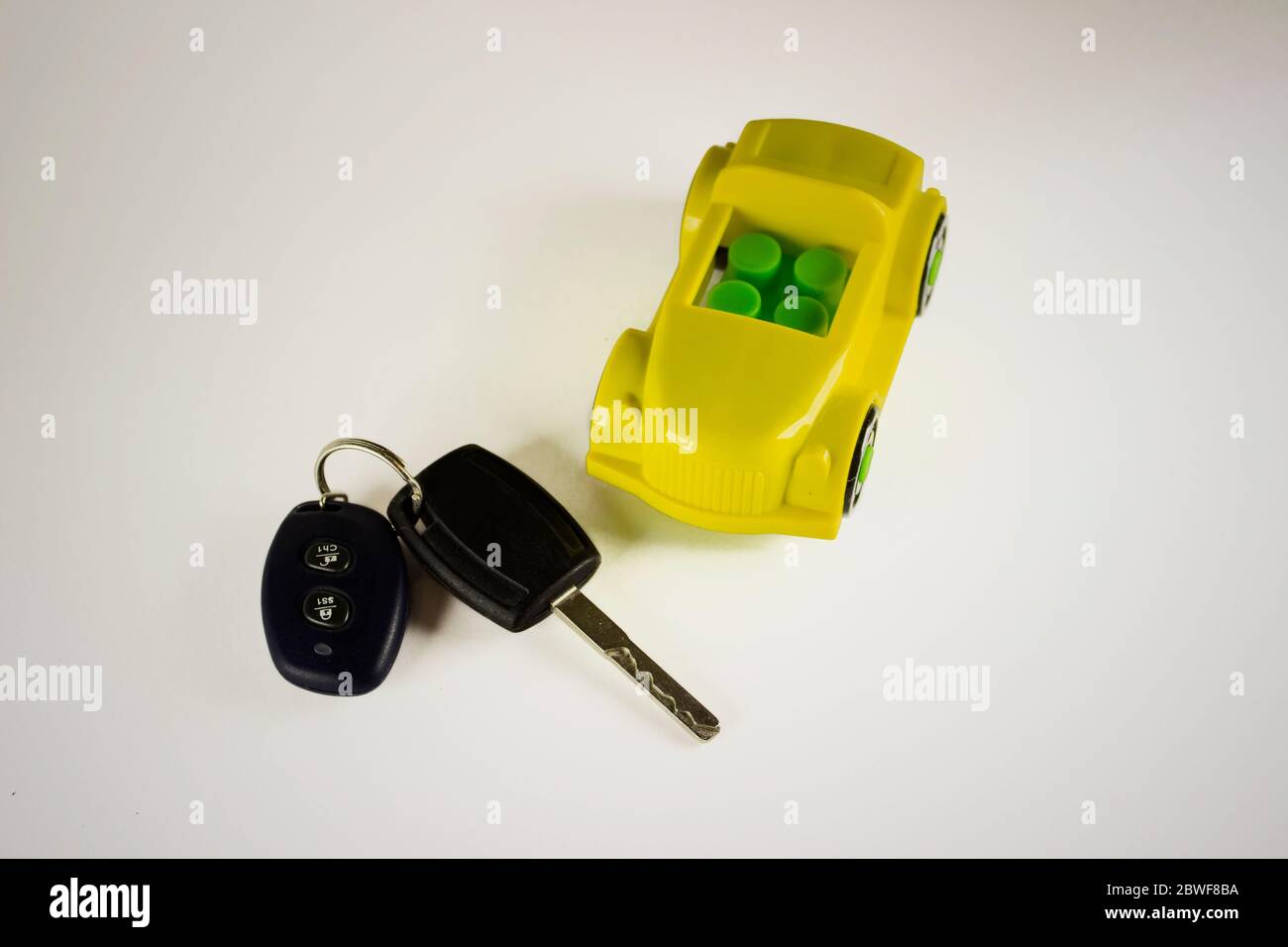 Car Key, Yellow Toy Car On White background. Toy car with a keys on ...