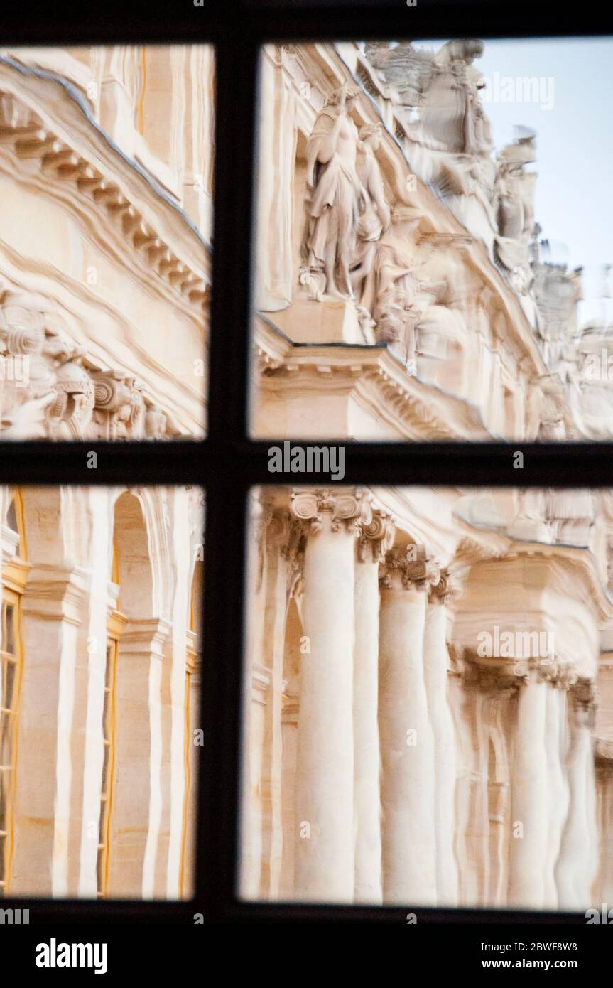 Richly detailed Baroque Ionic Order columns are seen from wavy handmade ...