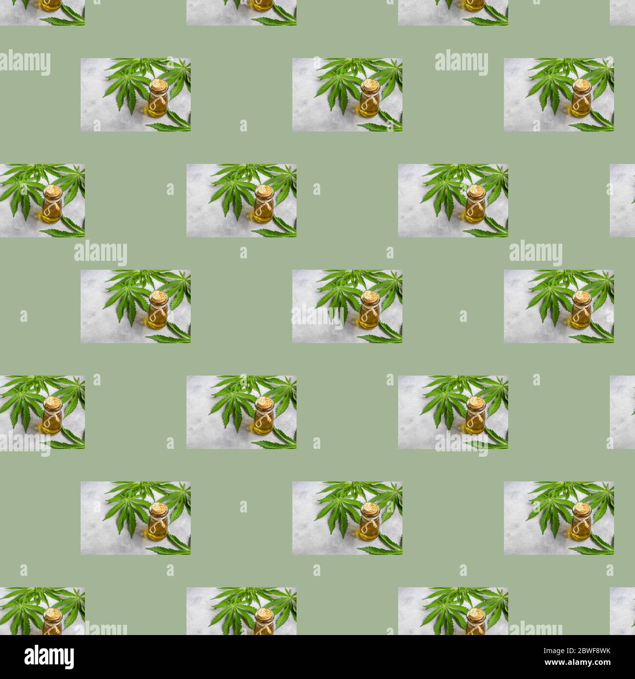 Seamless pattern with cannabis leaves and a bottle of oil on a green ...