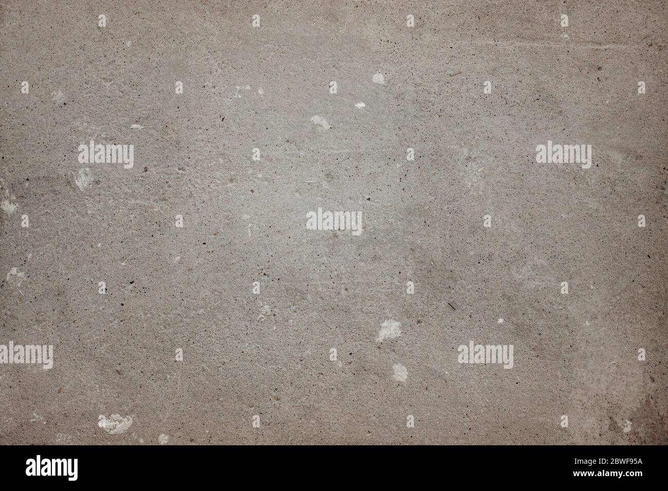 Texture of concrete and plaster on the wall. Wavy lines in the plaster ...