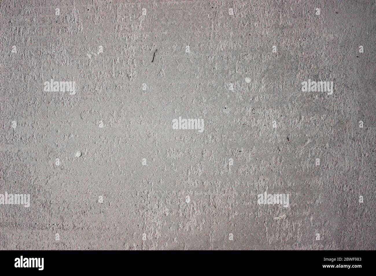 Texture of concrete and plaster on the wall. Wavy lines in the plaster ...