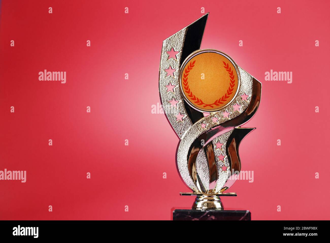 Gold prize on a red background. Super prize Stock Photo - Alamy