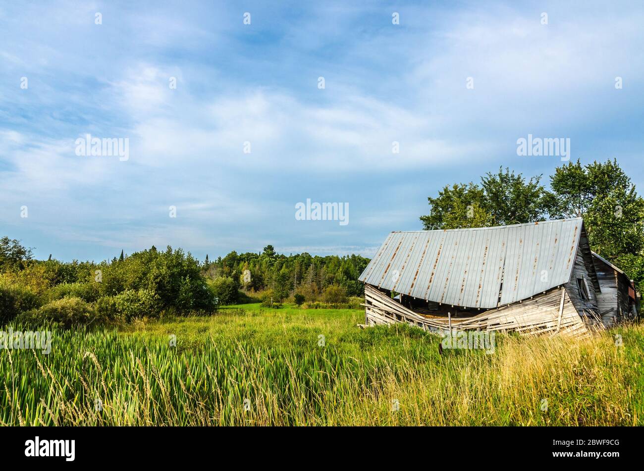 Ruins old barn in farmland at sunset Stock Photo - Alamy