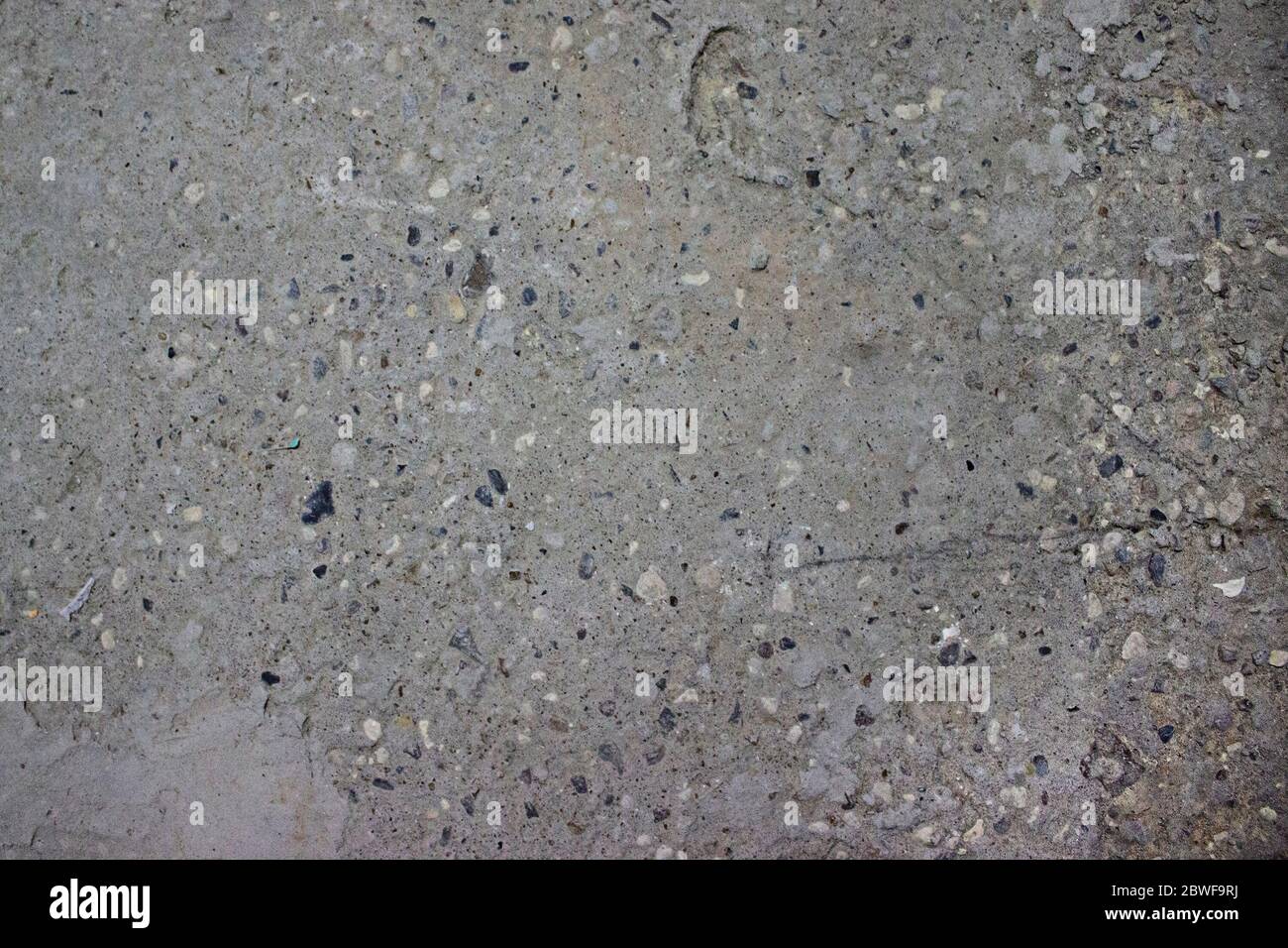 Texture of concrete and plaster on the wall. Wavy lines in the plaster ...