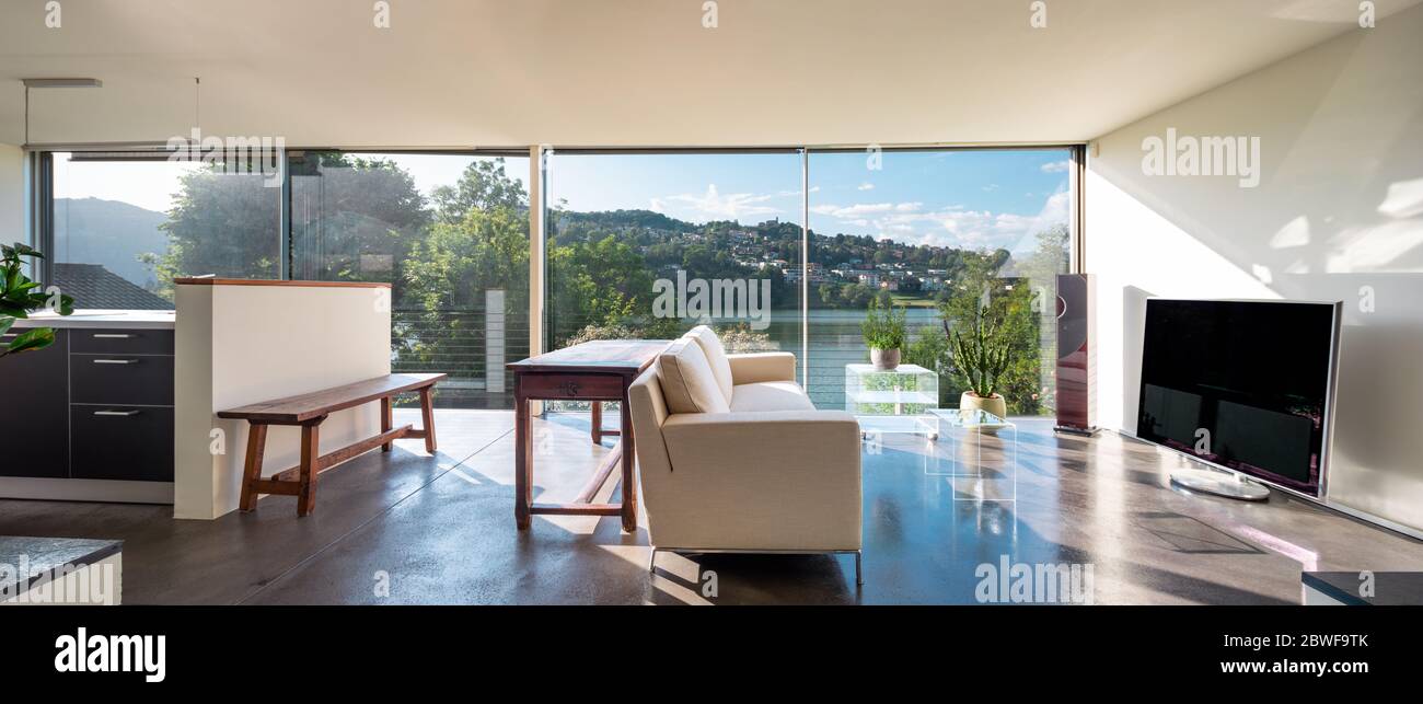Living room interior with sofa and dream view Stock Photo - Alamy