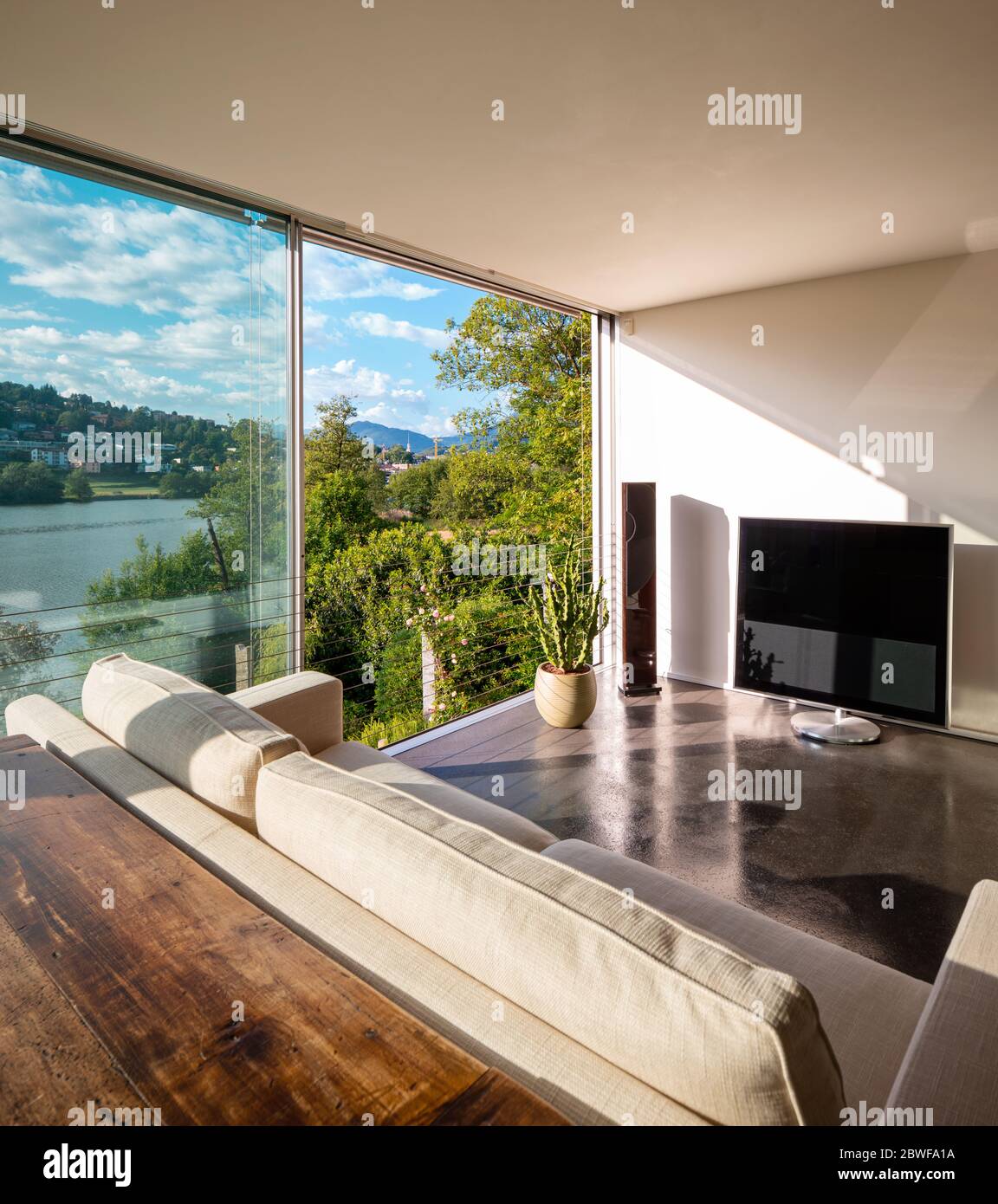 Living room interior with sofa and dream view Stock Photo - Alamy