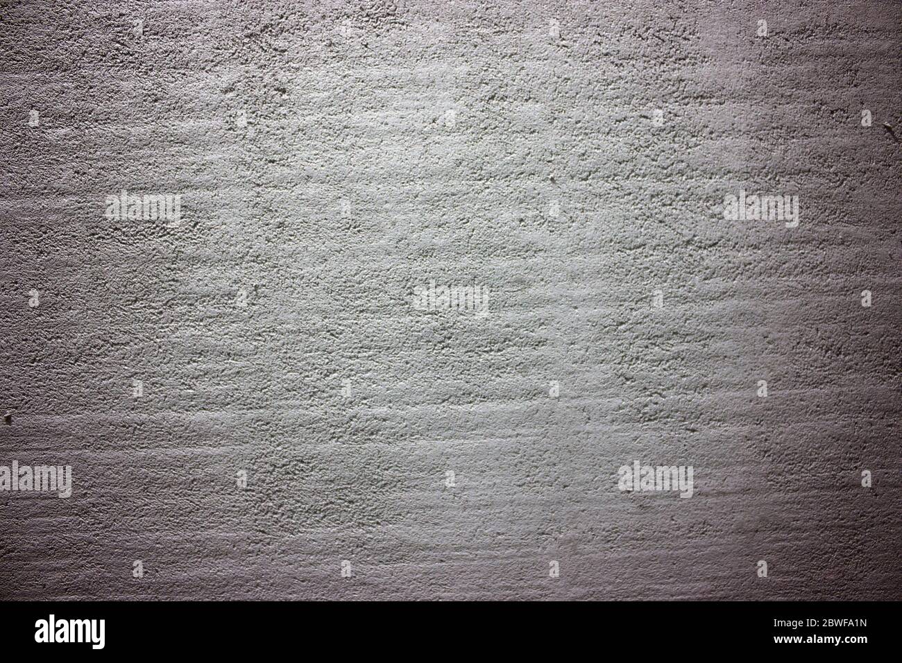 Texture of concrete and plaster on the wall. Wavy lines in the plaster ...