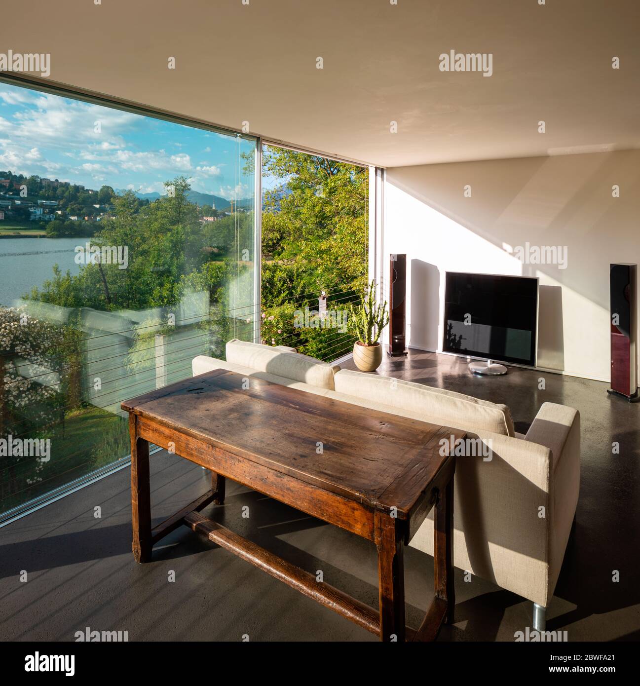 Living room interior with sofa and dream view Stock Photo - Alamy