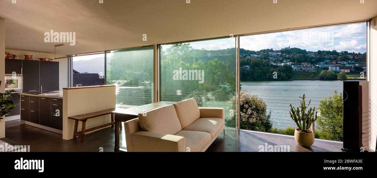 Living room interior with sofa and dream view Stock Photo - Alamy