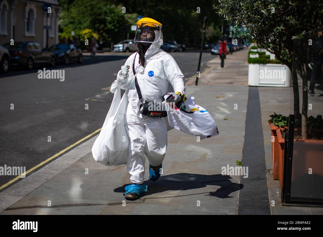 A man wearing full ppe walks through knightsbridge hi-res stock ...
