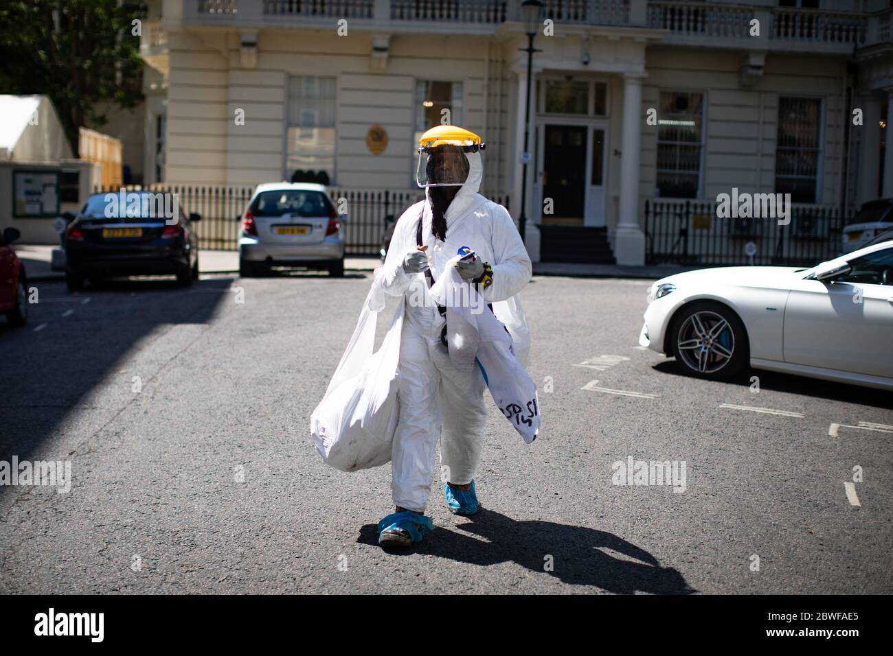 A man wearing full ppe walks through knightsbridge hi-res stock ...