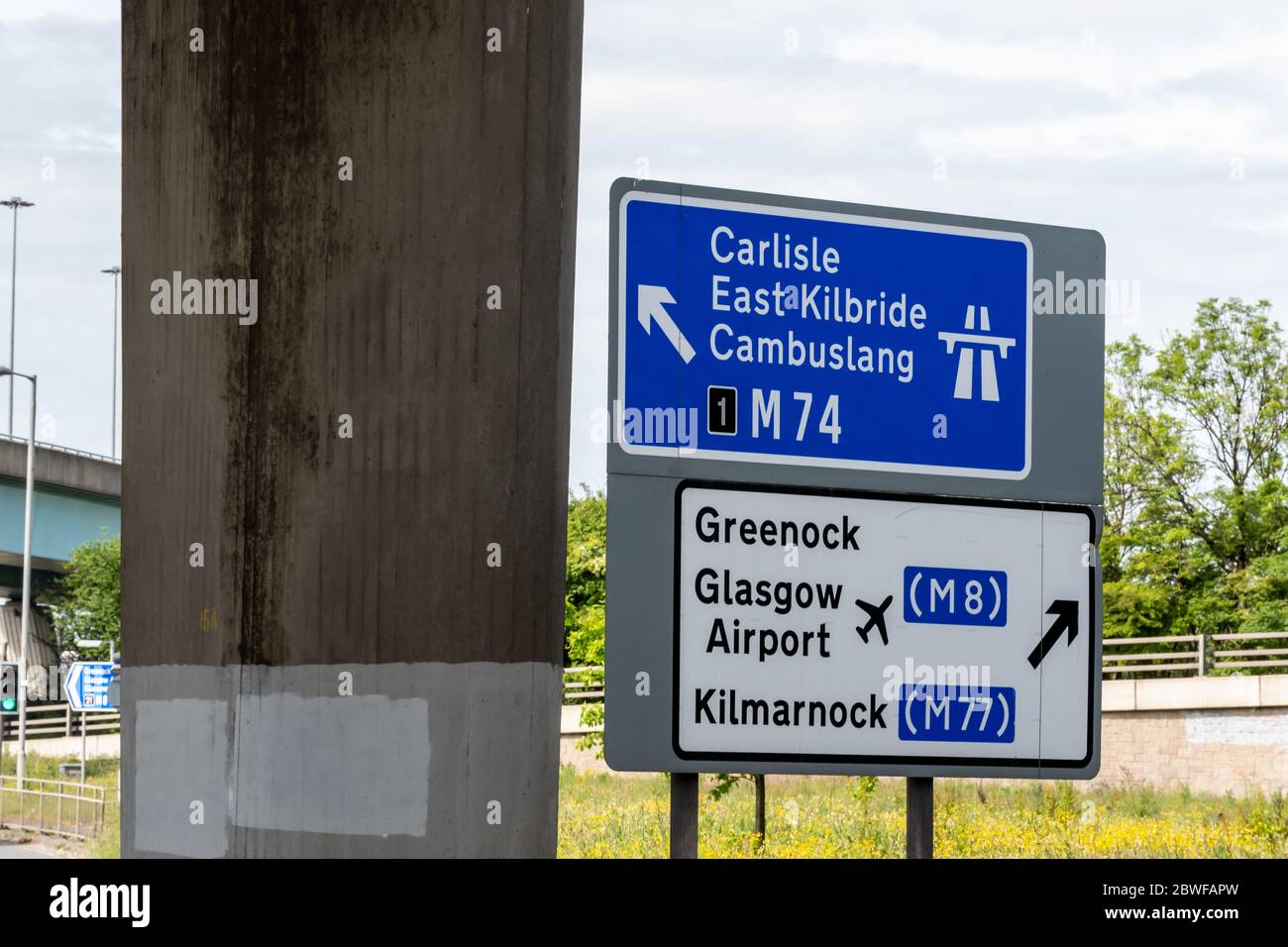 Road sign in Glasgow showing destinations for the M74, M8 and M77 ...