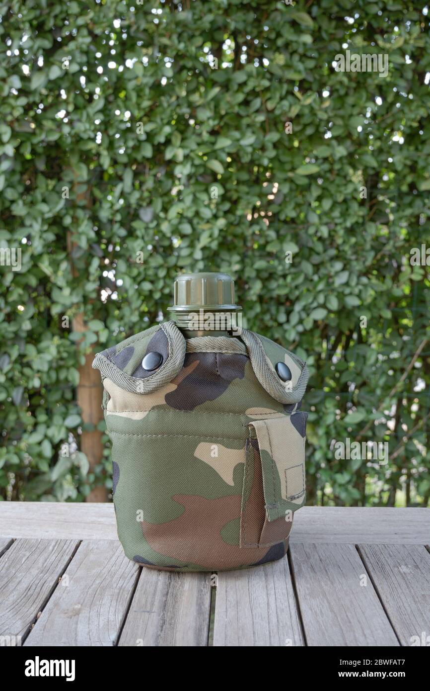 Camouflage army jar for water with a carrying case Stock Photo - Alamy