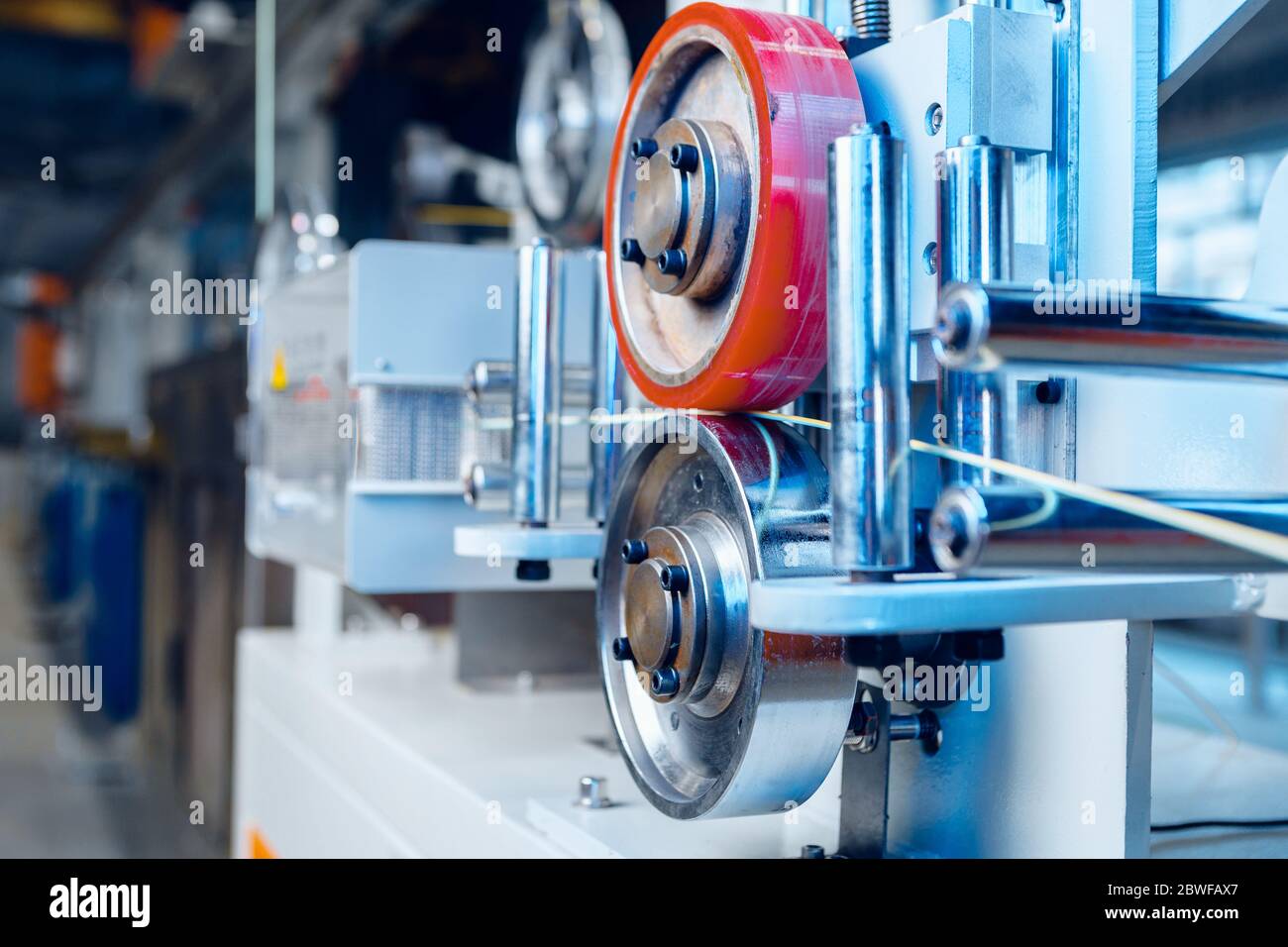 Inside a modern plant producing power electric cables and optical ...