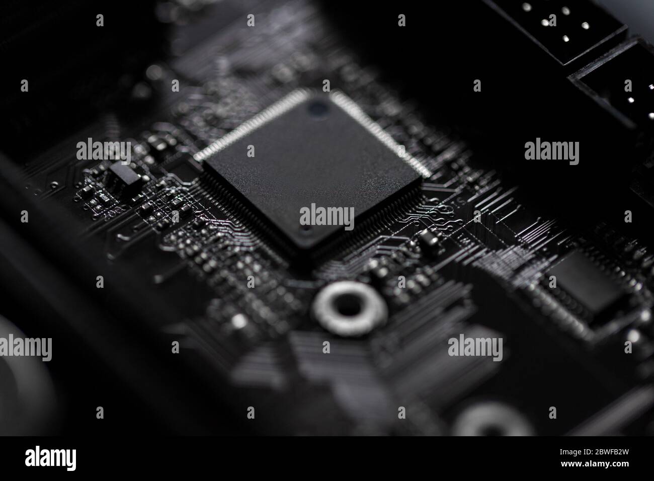 modern black computer chips on an mainboard Stock Photo - Alamy