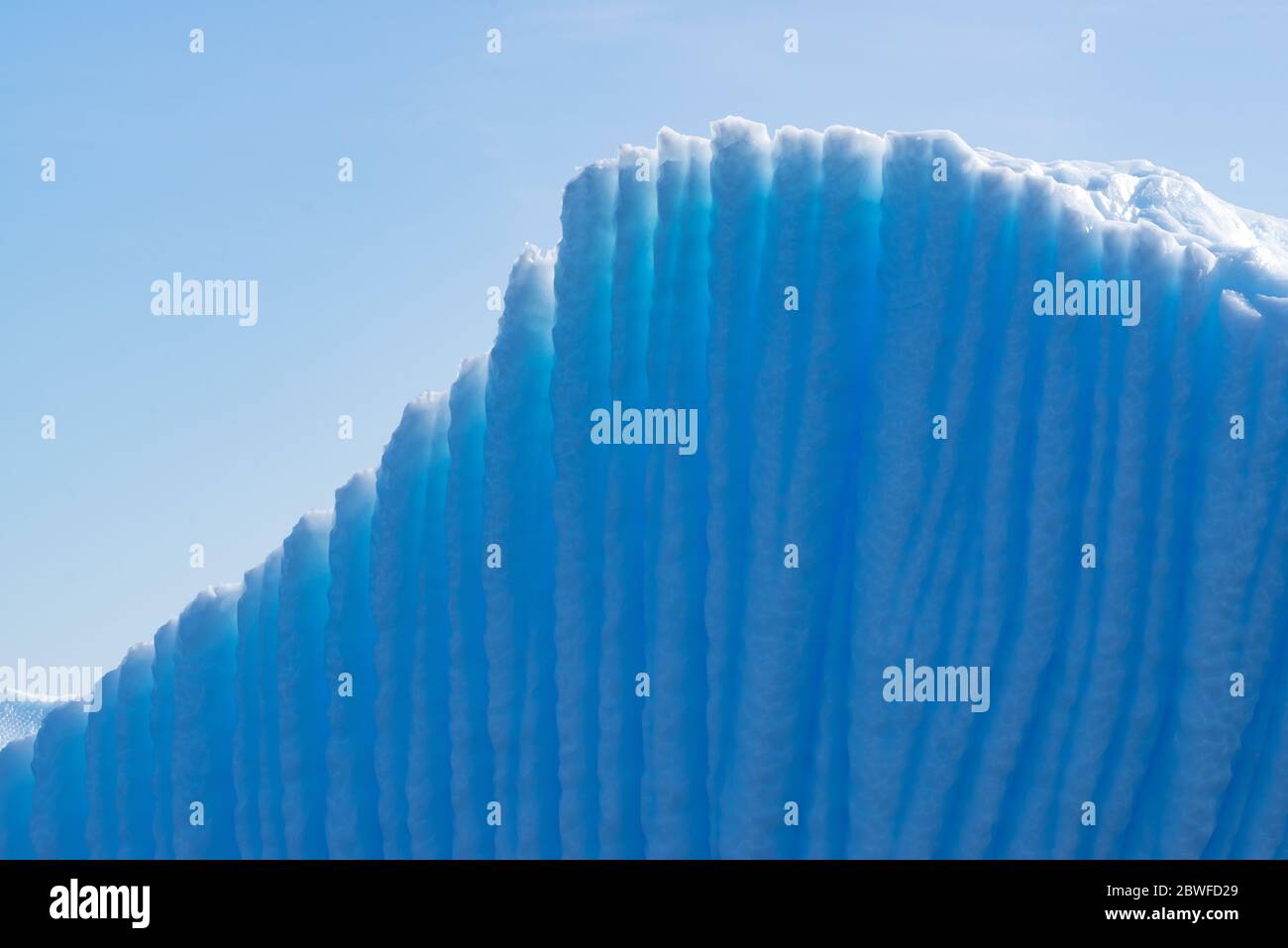 Structure of a blue melting iceberg Stock Photo - Alamy