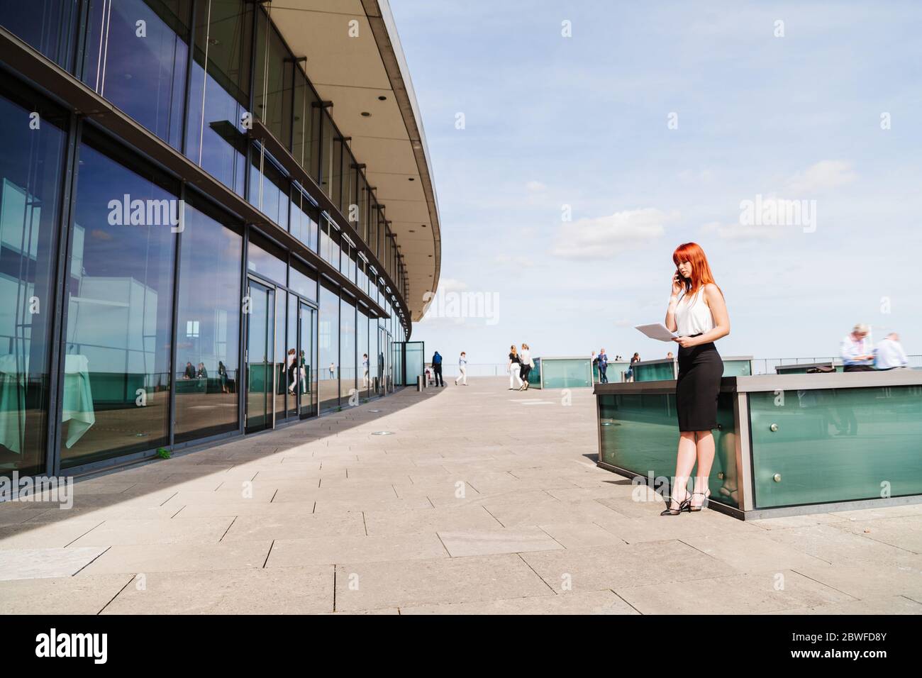 Young redhead business woman in formal outside Stock Photo - Alamy