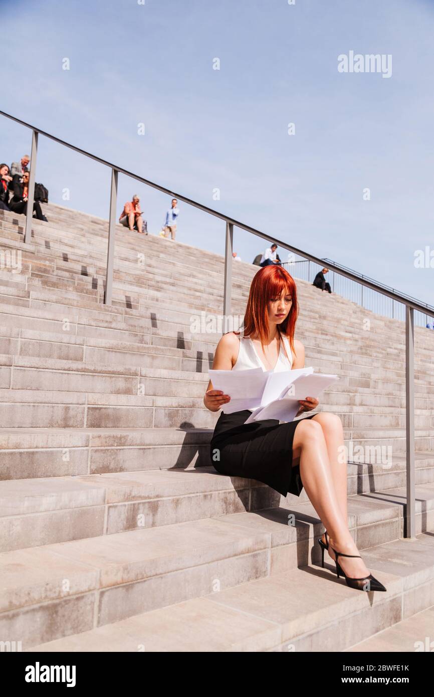 Young redhead business woman in formal outside Stock Photo - Alamy