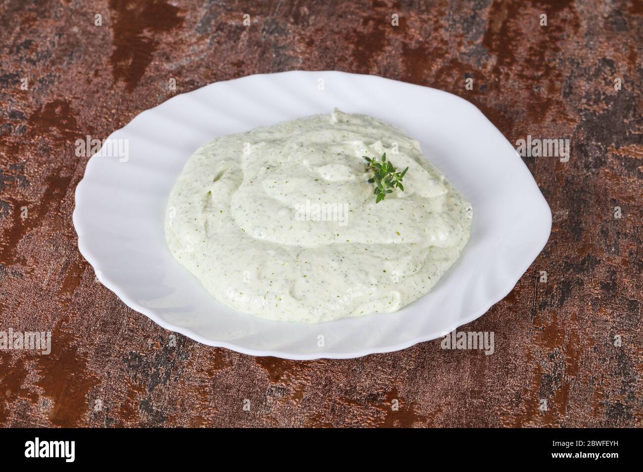 Cottage cream snack with herbs and garlic Stock Photo - Alamy
