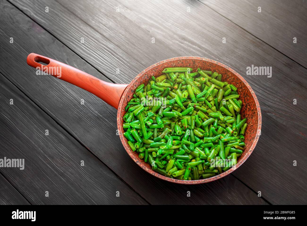 Vegetarian food. Fried string beans in a pan. Stylish background for ...