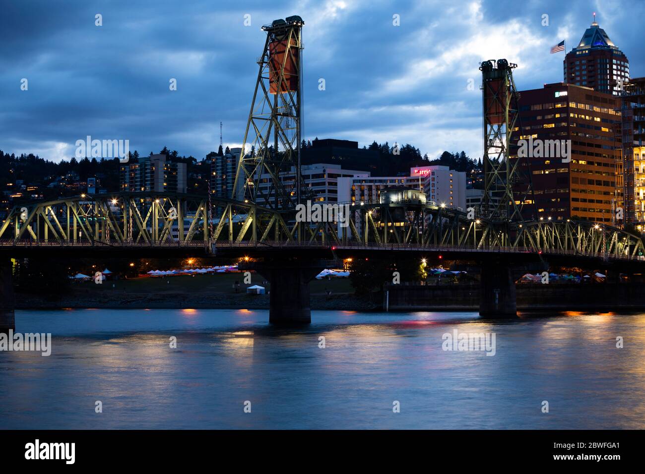 Steel, vertical lift bridge over Willamette River at sunset, Portland ...